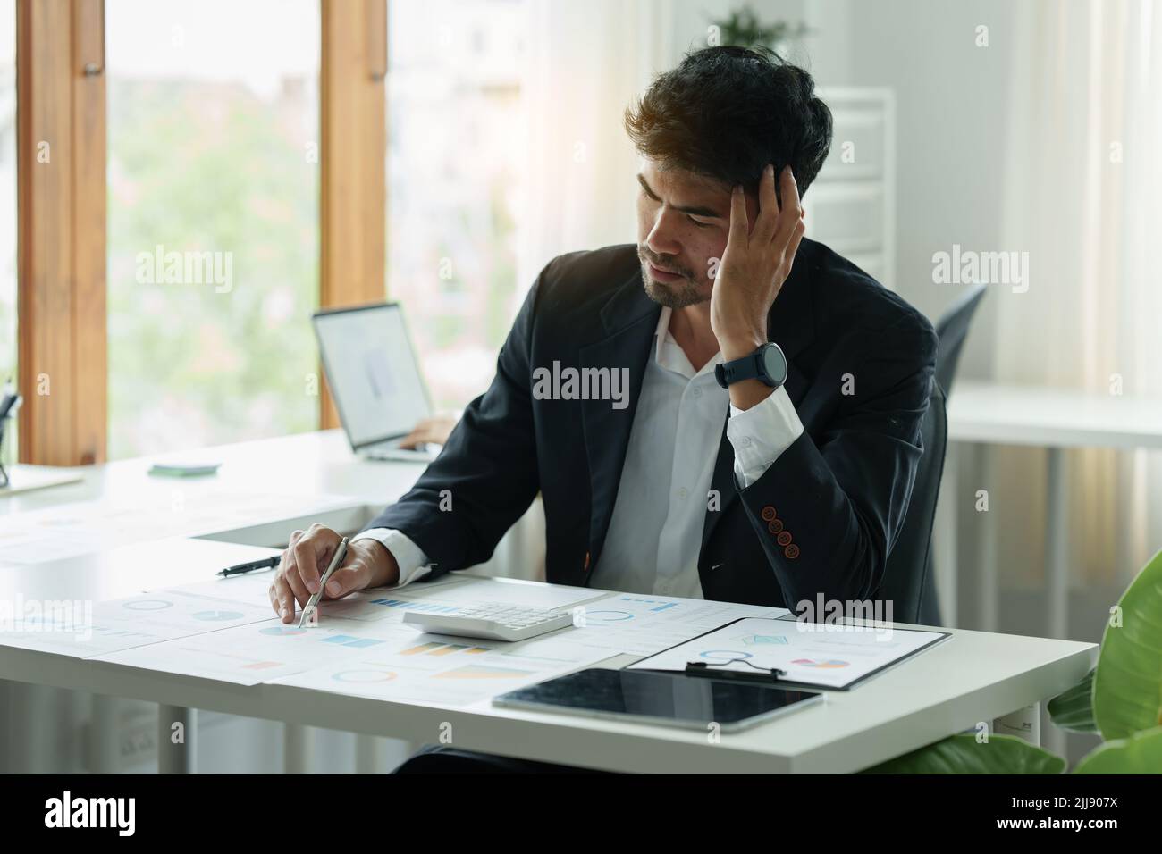 Portrait of Frustrated Business man have problem while sitting at her ...