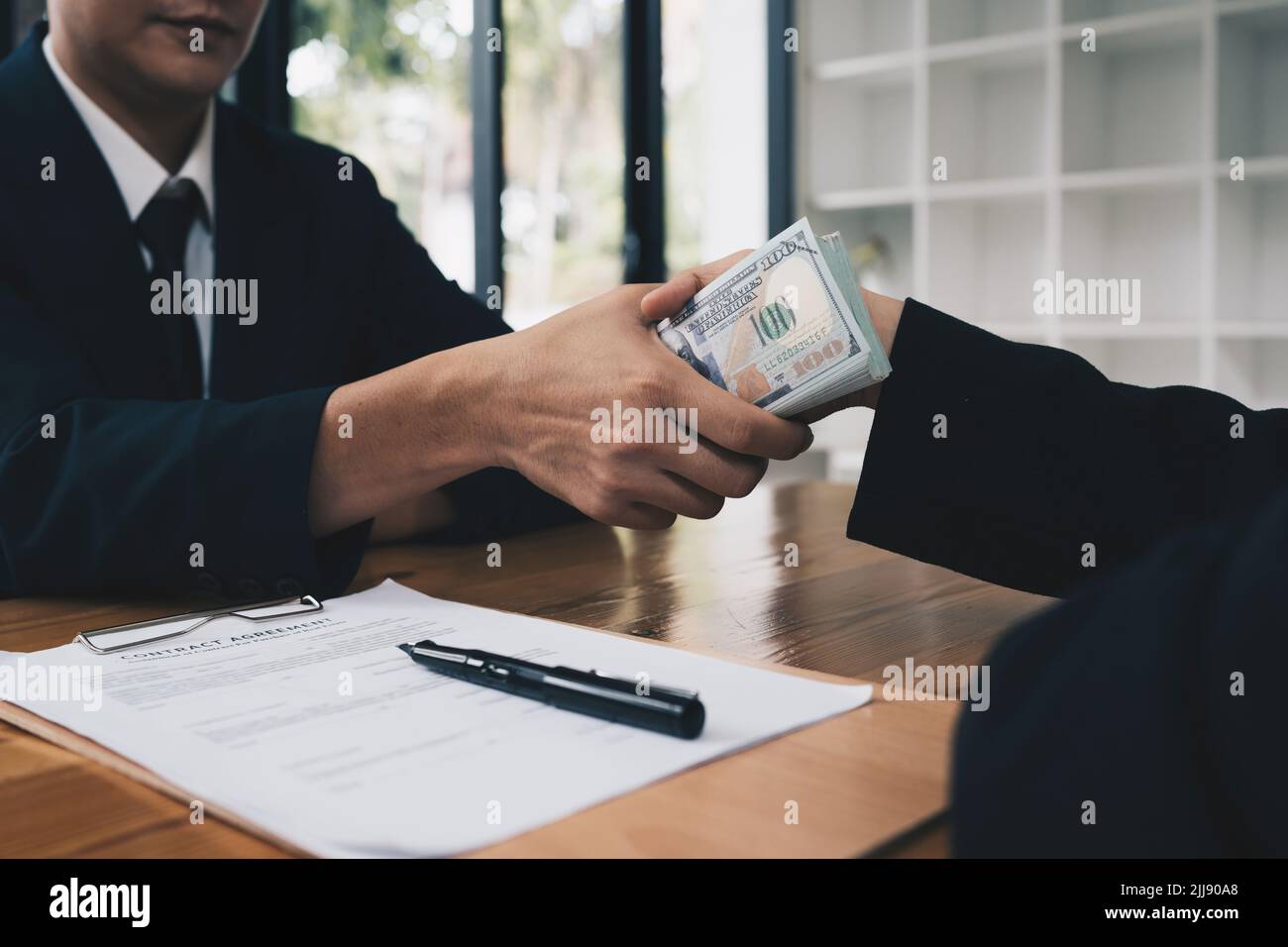 Partner give bribe money in envelope to another businessman. Corruption ...