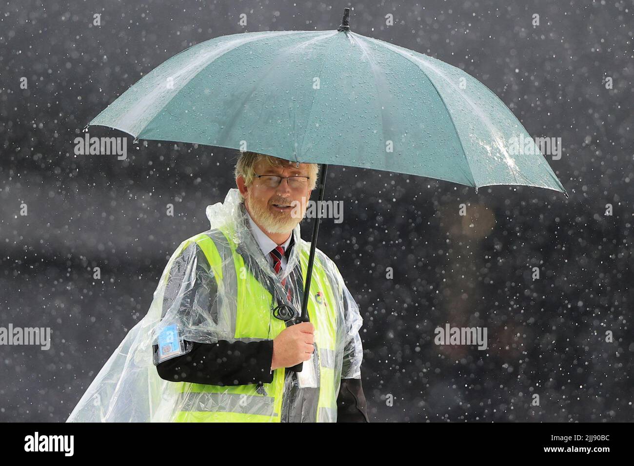 Security staff member guarding the wicket at a rain soaked Headingley ...