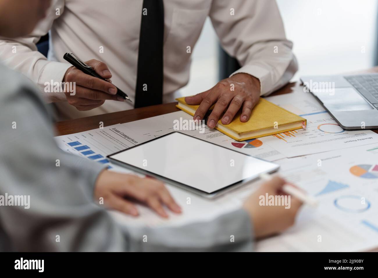 Administration or Accountant discussing with partner are meeting to ...