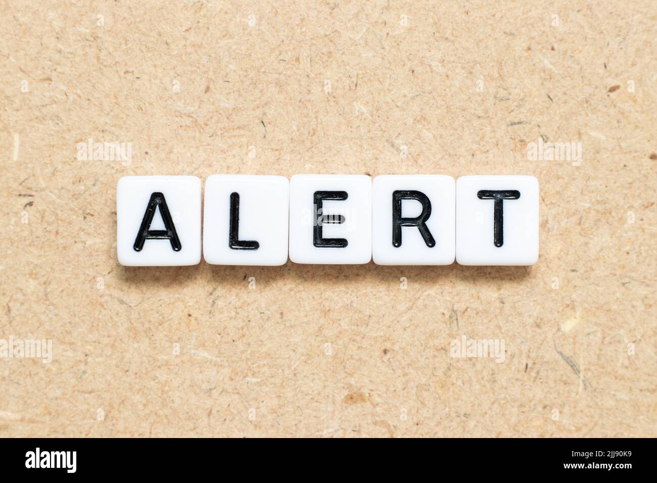 White tile alphabet letter with word alert on wood background Stock ...