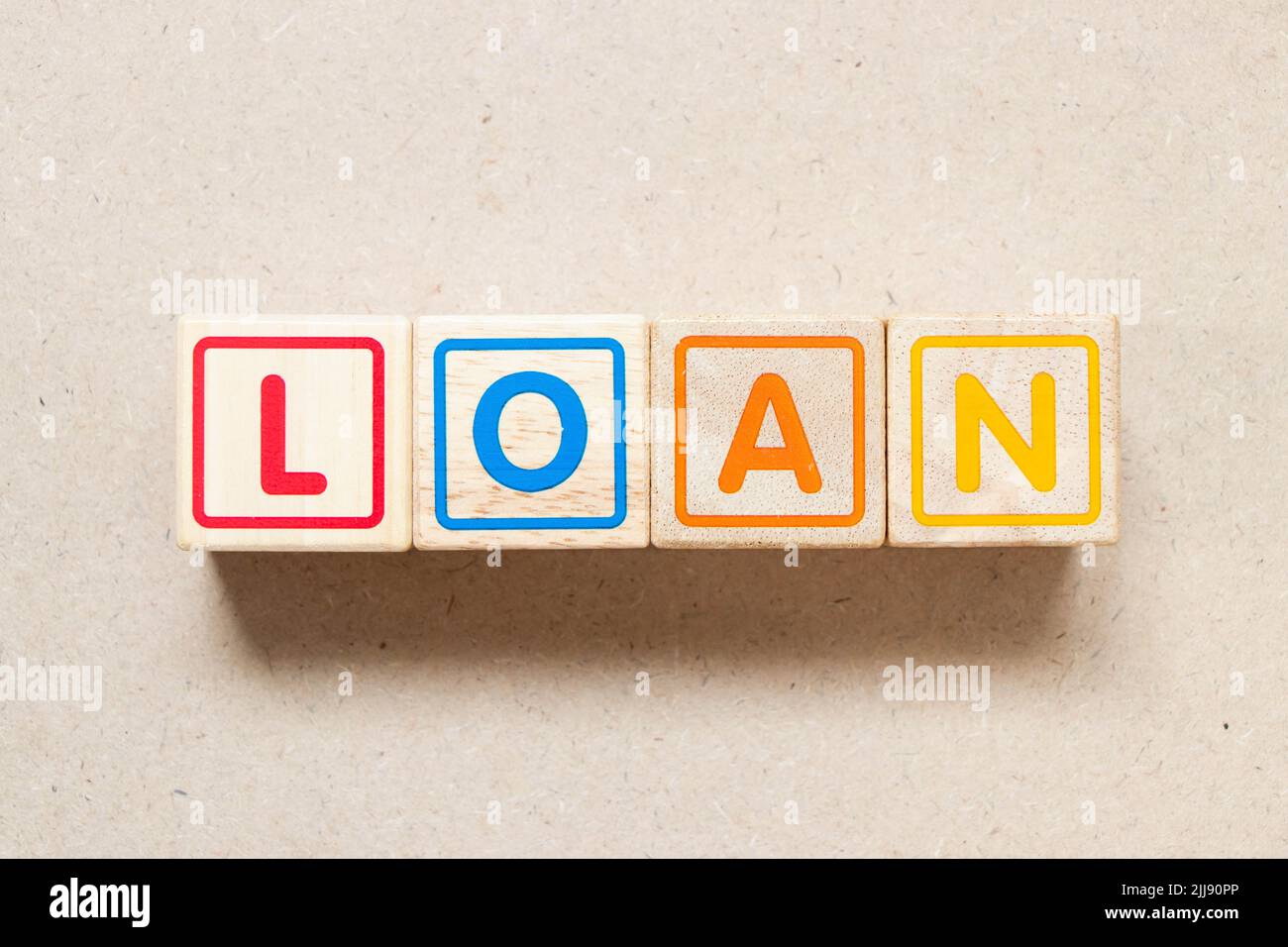 Color letter block in word loan on wood background Stock Photo - Alamy