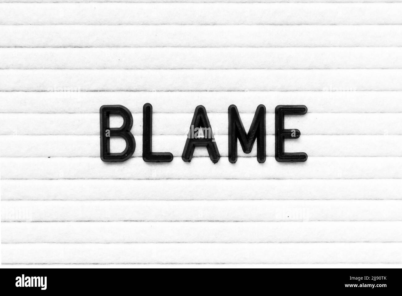 Black color letter in word blame on white felt board background Stock ...
