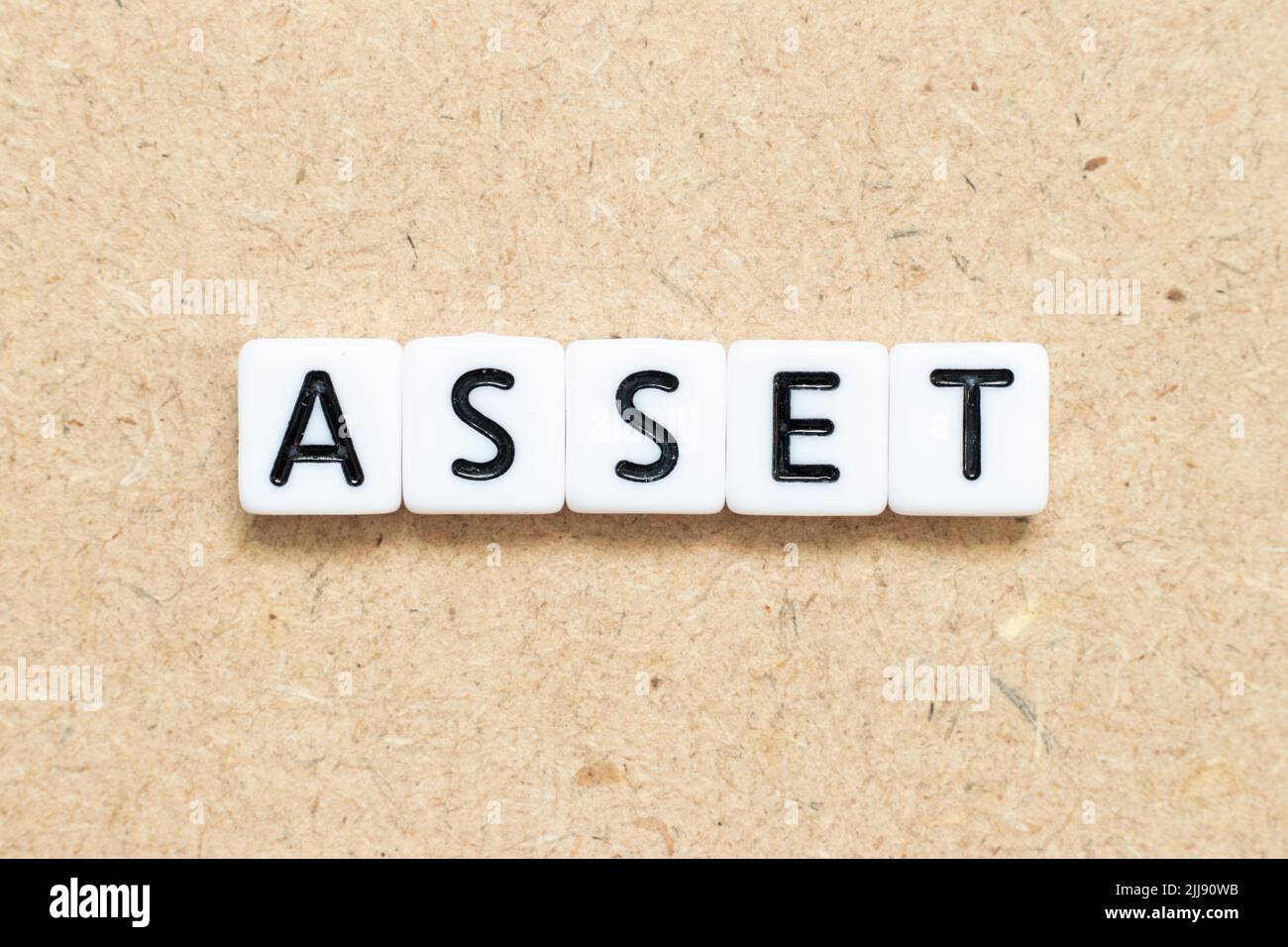 White tile alphabet letter with word asset on wood background Stock ...