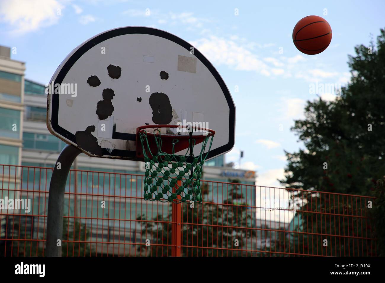 A guy playing street basketball in downtown Helsinki, Finland, August ...
