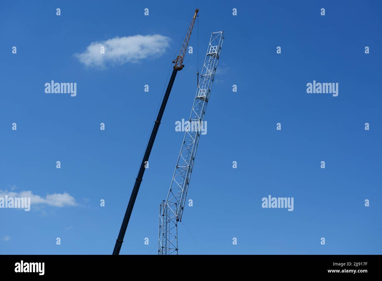 July 23, 2022, Cherkasy, Ukraine: A team of fitters using a crane ...