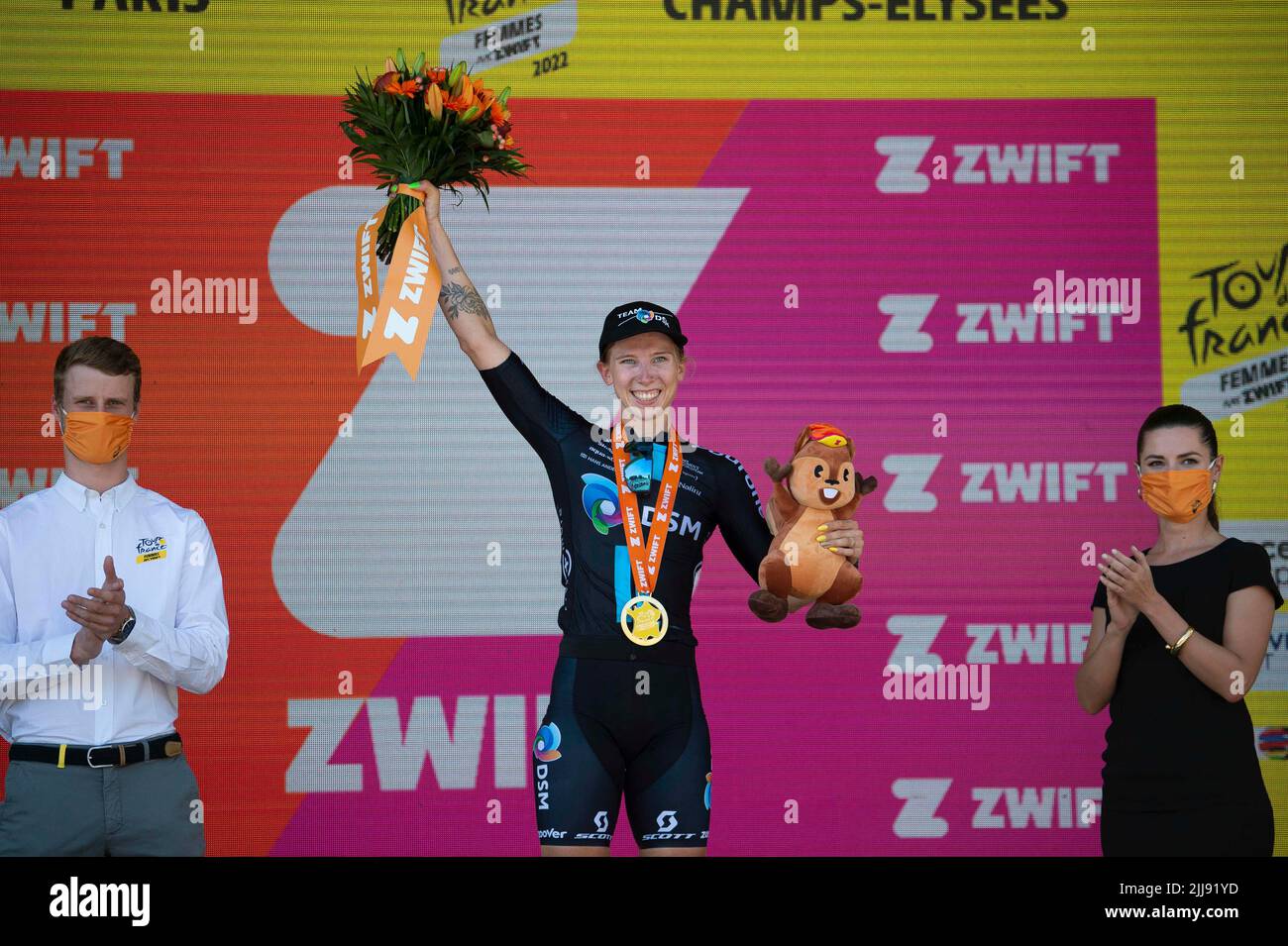 Team DSM's Dutch rider Lorena Wiebes holding her child celebrates her ...