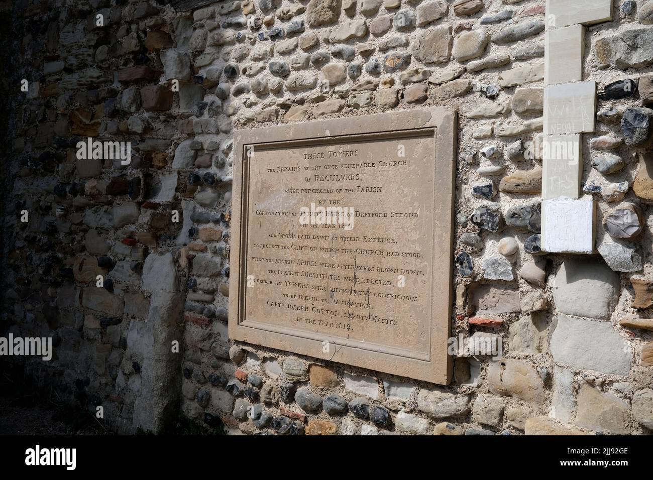 stone plaque affixed to a wall of the twin towers ruined monastry in ...
