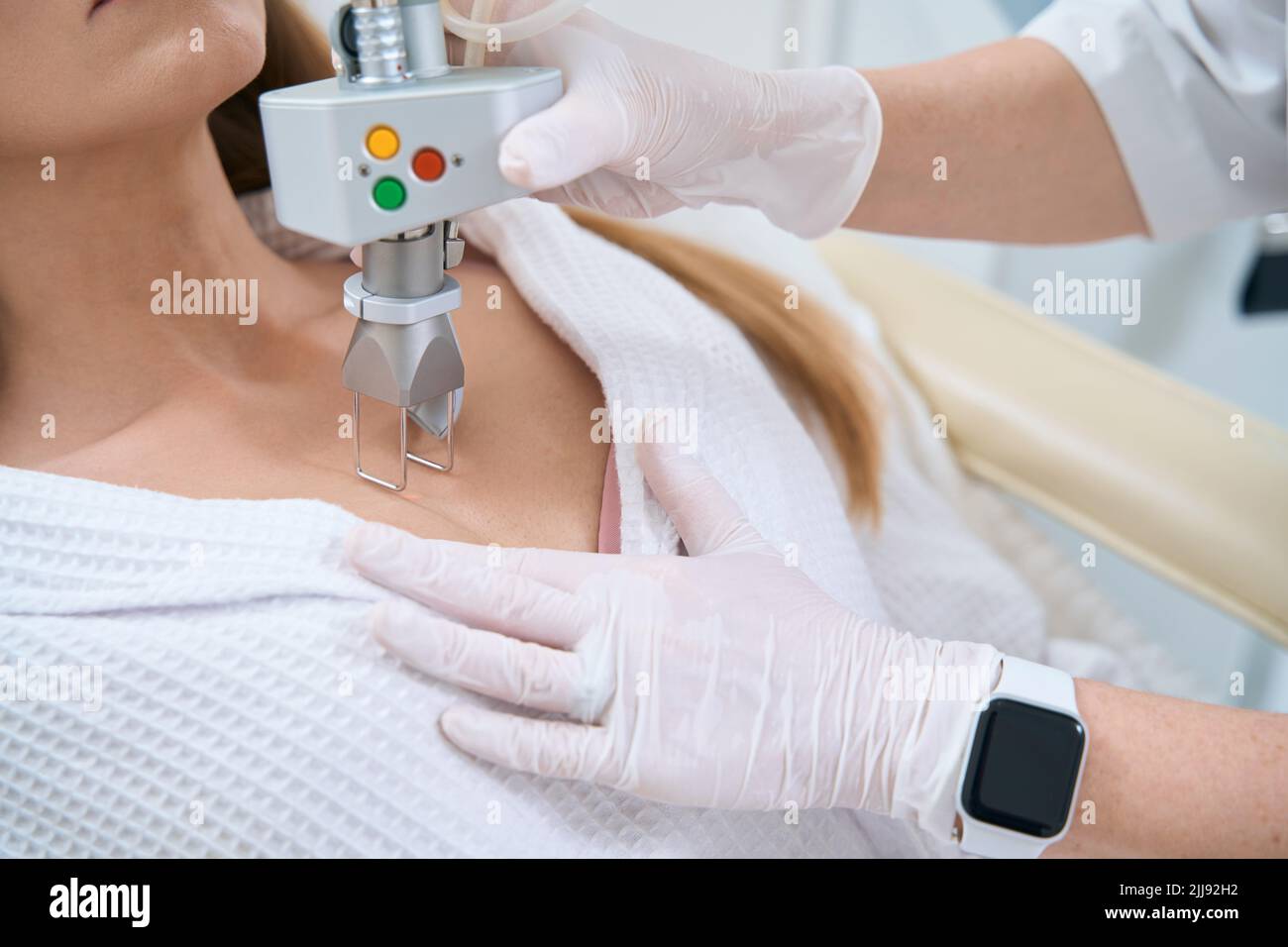 Procedure of laser removal of neoplasms in a cosmetology clinic close ...