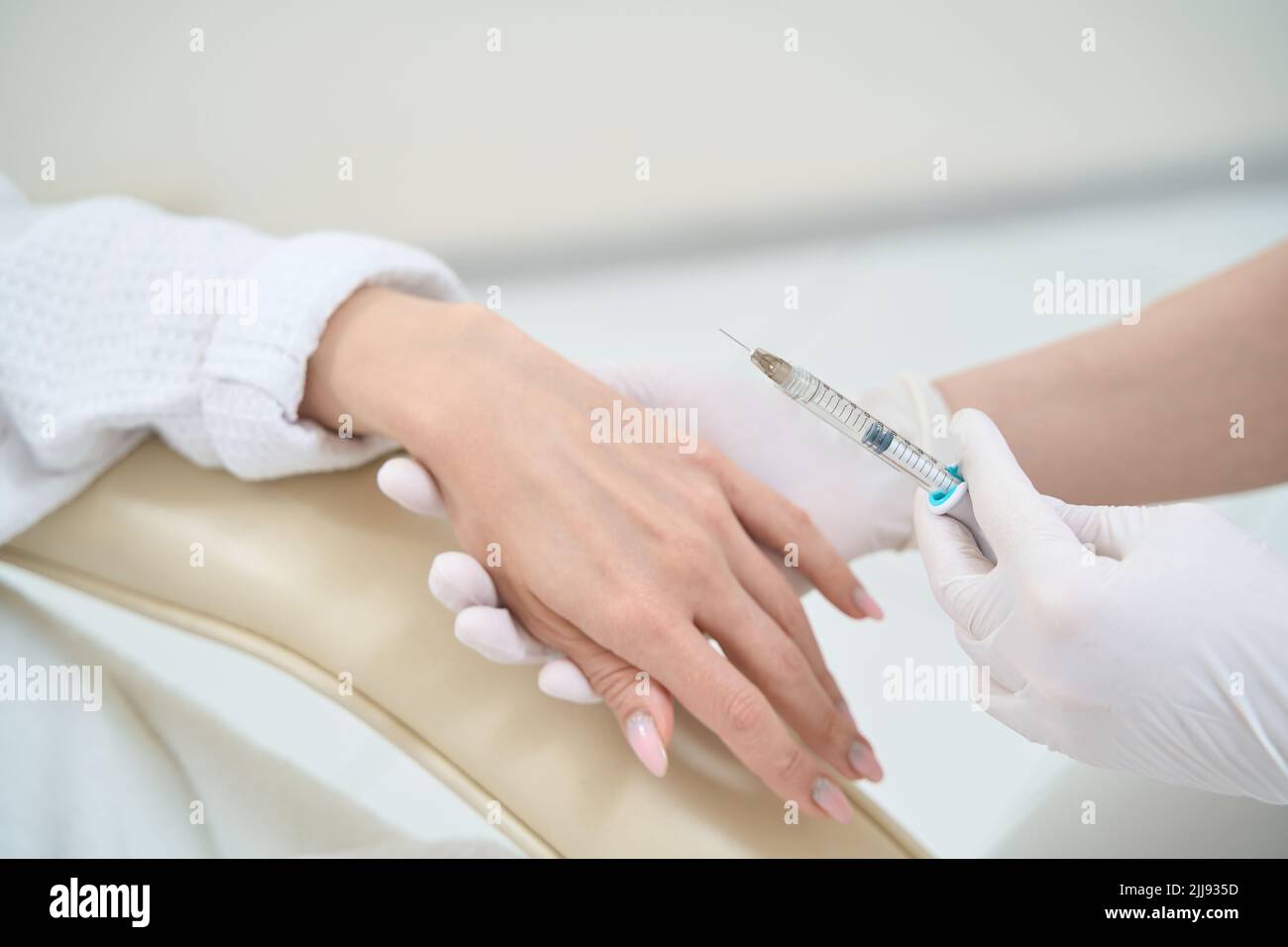 Wrist injection hi-res stock photography and images - Alamy