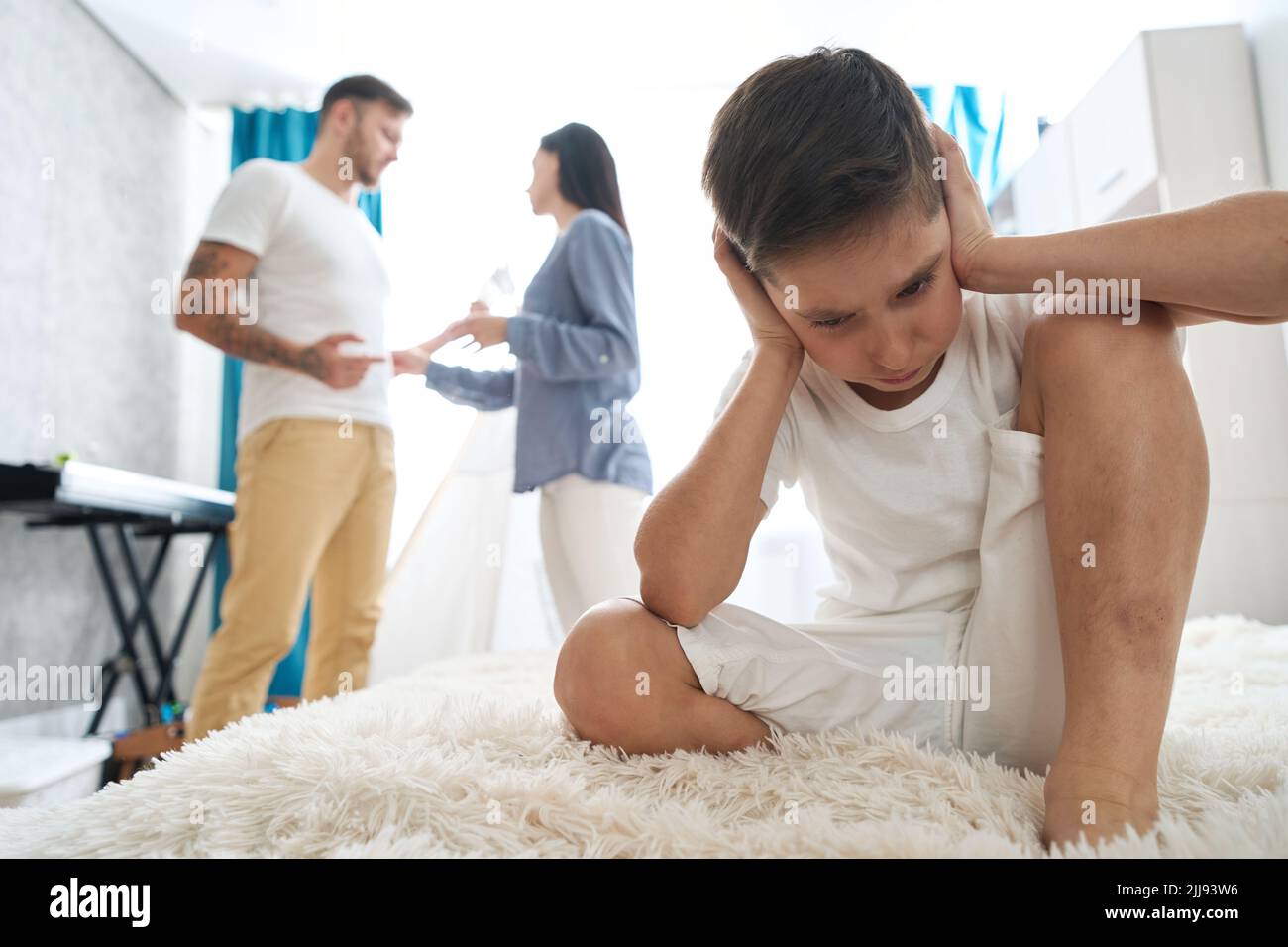 Parents sort things out in the children room with the child Stock Photo ...