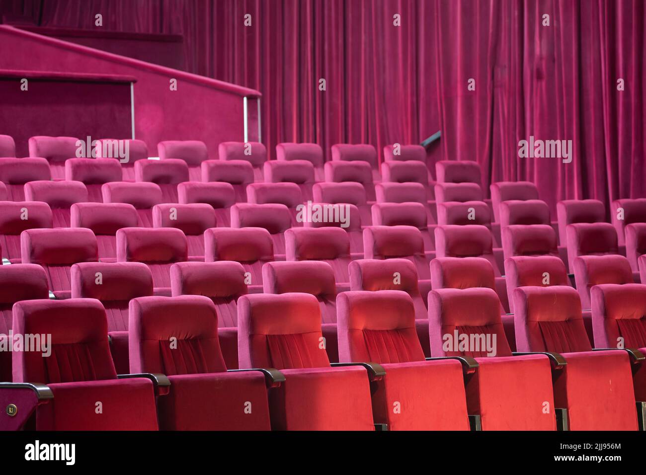 Empty cinema hall with red seats. Movie theatre Stock Photo - Alamy
