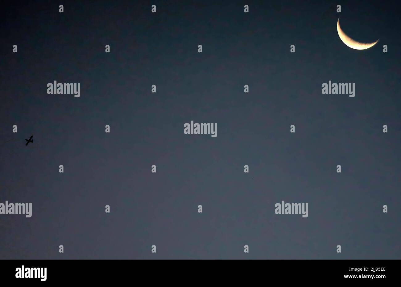 An Israeli drone is seen flying over Gaza City with the moon in the ...