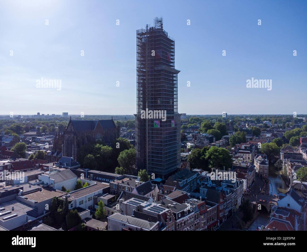 A high-rise building being constructed in a mid-rise city Stock Photo ...