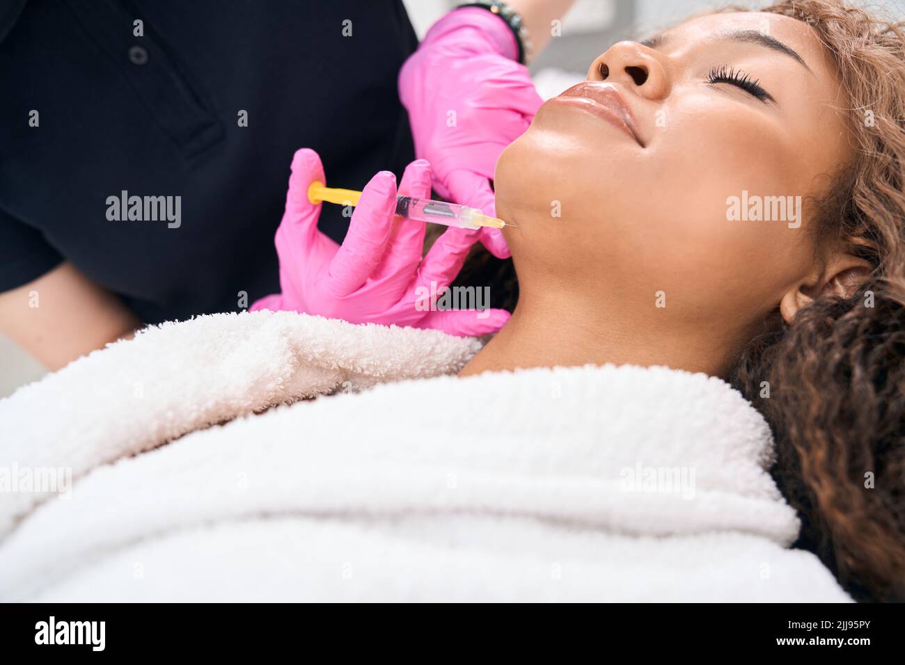 Patient undergoing a chin correction procedure with botulinum toxin ...