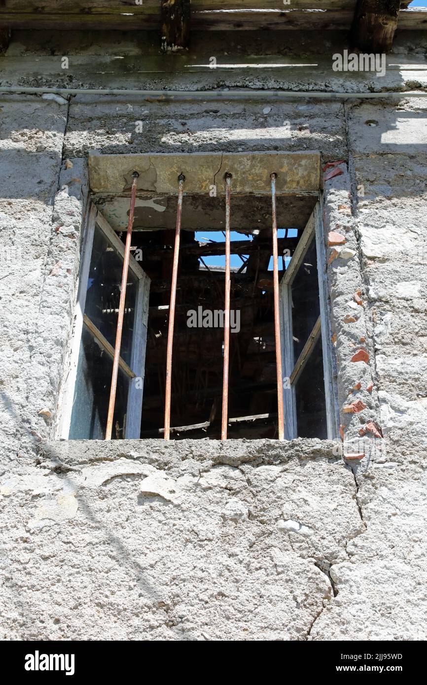 detail of the window without the frames of an abandoned and destroyed ...