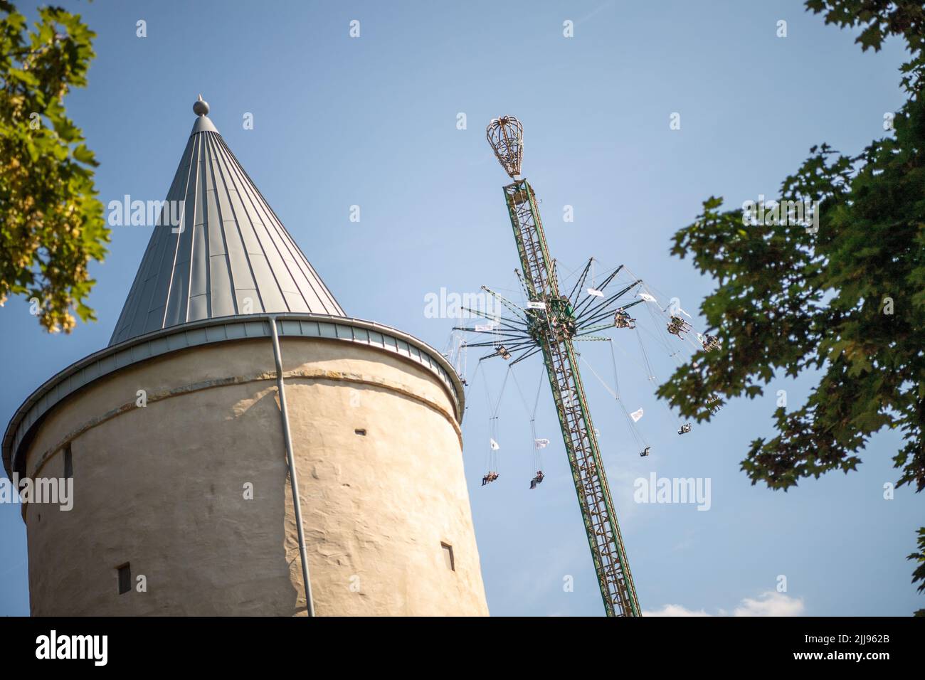 Paderborn, Germany. 24th July, 2022. A giant chain carousel can be seen ...