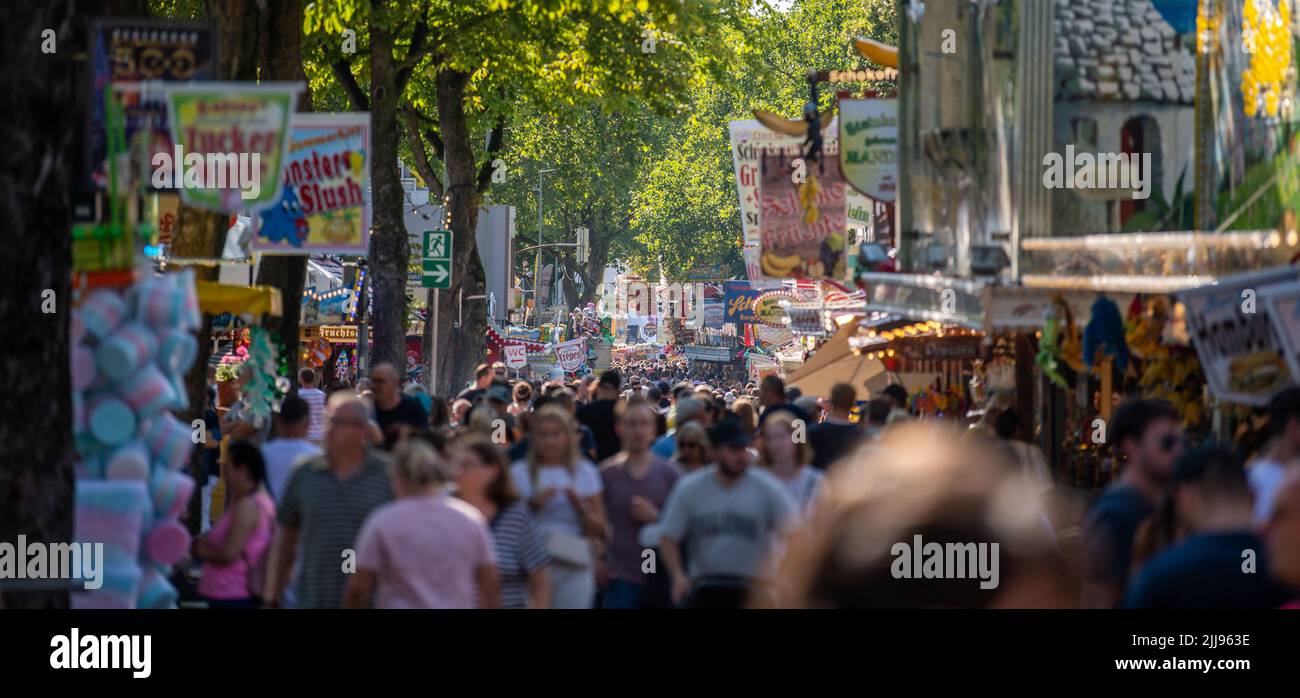Paderborn, Germany. 24th July, 2022. Visitors cavort between funfair ...