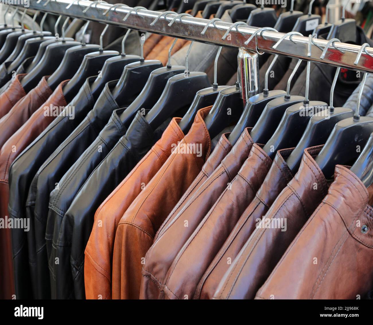 leather jackets for sale in the leather goods shop attached to hangers ...