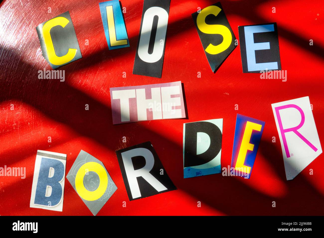 "Close the Border" using cut-out paper letters in the ransom note ...