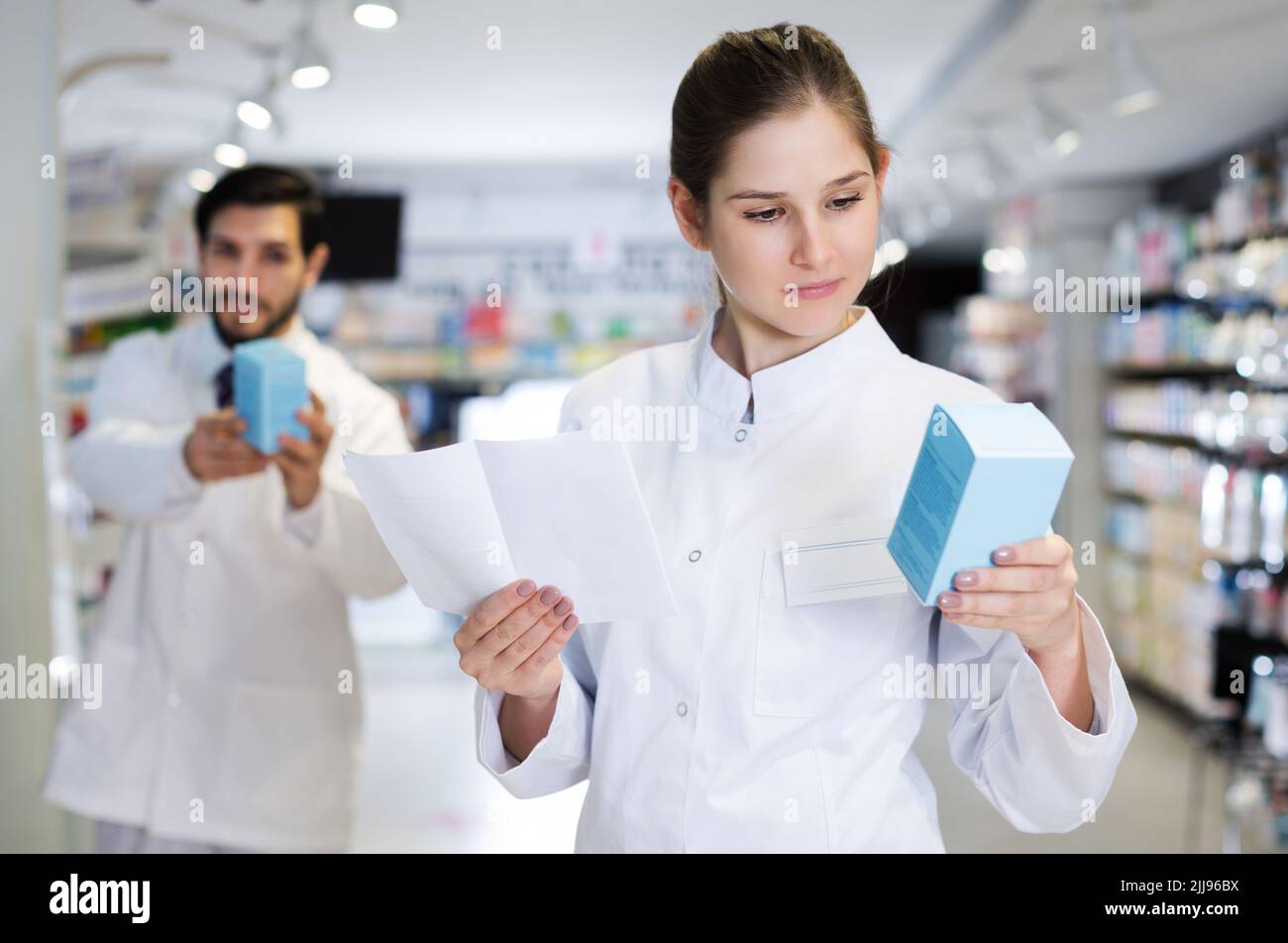 pharmacist who is standing with medicine Stock Photo - Alamy