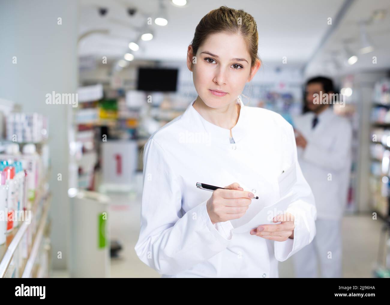 girl pharmacist is conducting a stocktaking of medicines Stock Photo ...