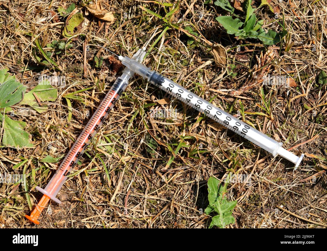 two abandoned infected syringes used by drug addicts to inject drugs ...