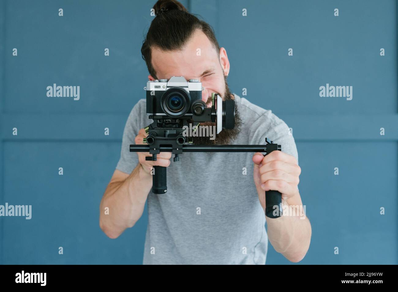 technology video shoot man hold camera equipment Stock Photo - Alamy