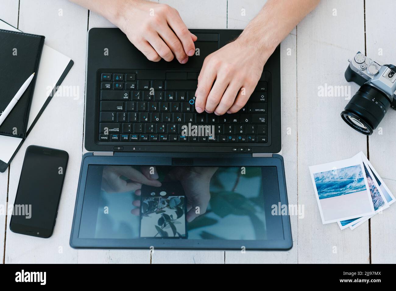 photography art photo retouching man hands laptop Stock Photo - Alamy