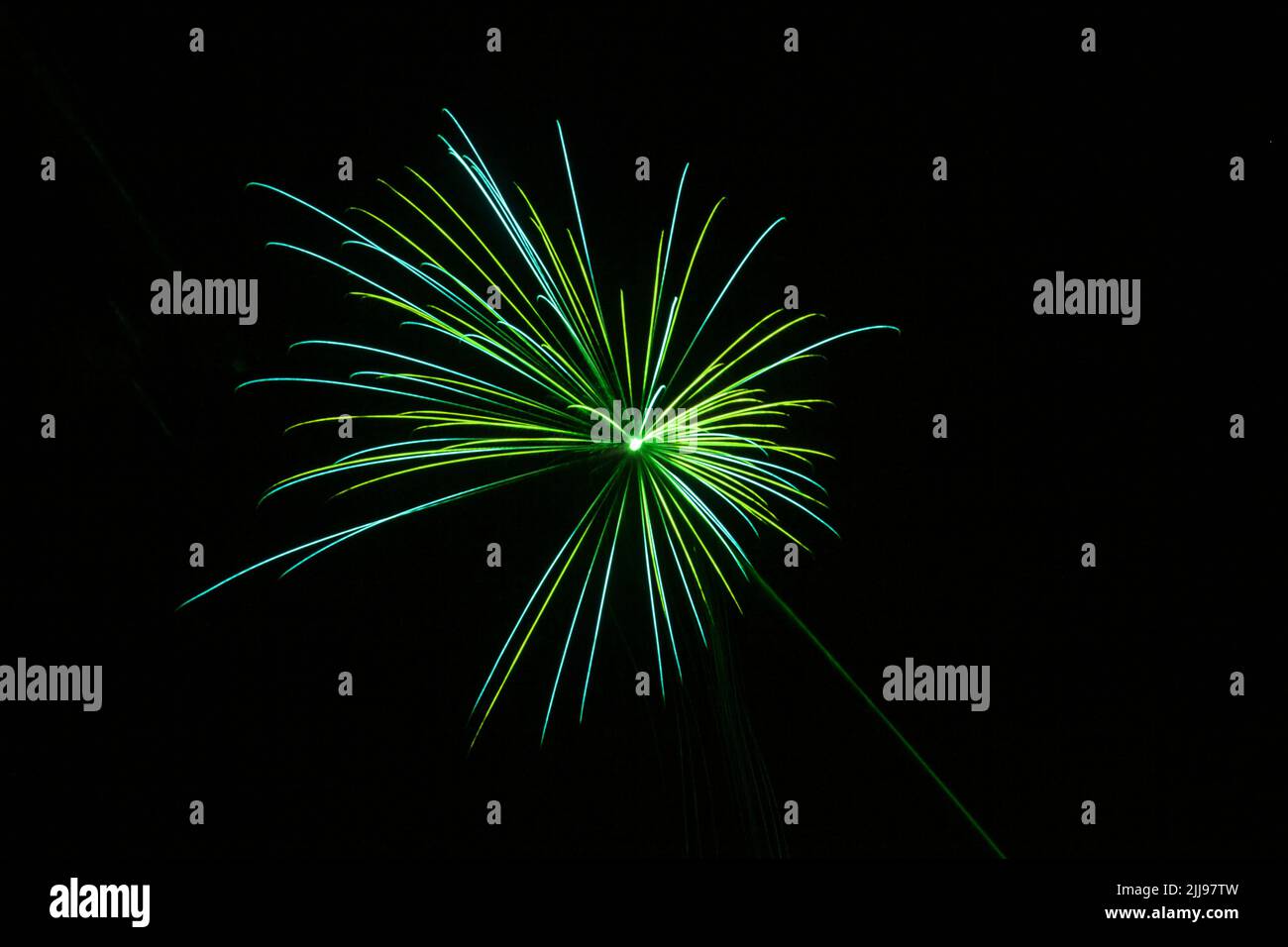 A green firework in the night sky Stock Photo - Alamy