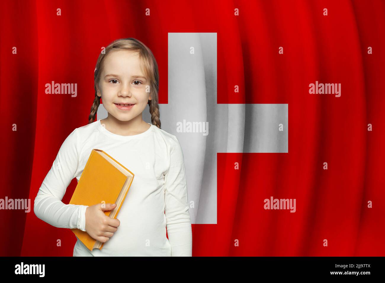 Small school girl on Swiss flag background. Education and school in ...