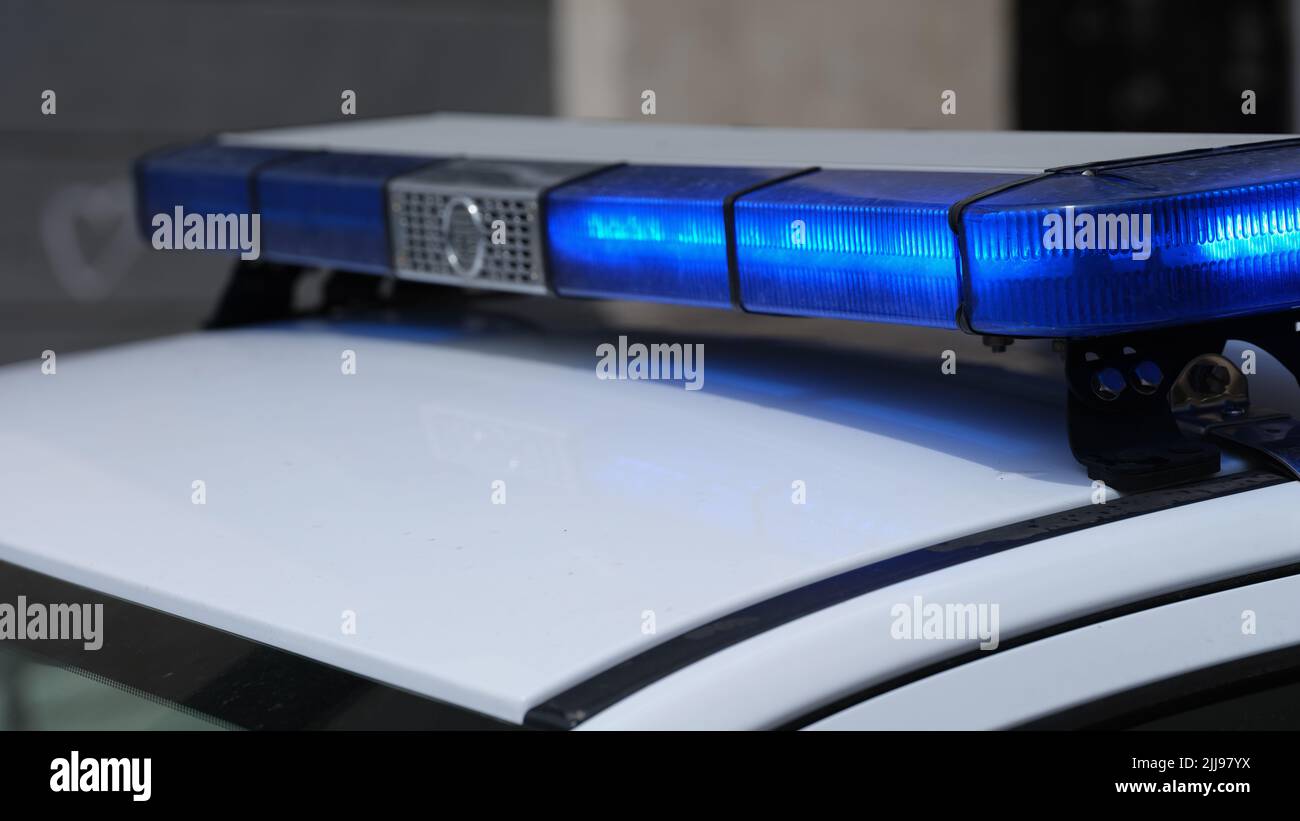 Police lights on car watching traffic on city road Stock Photo - Alamy