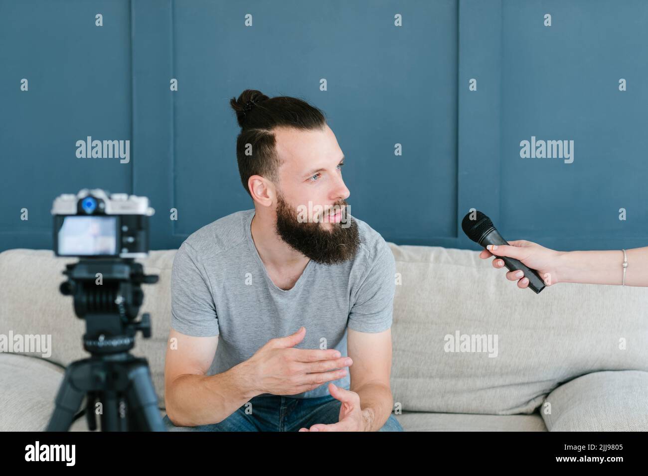 mass media influencer man interview journalist mic Stock Photo - Alamy