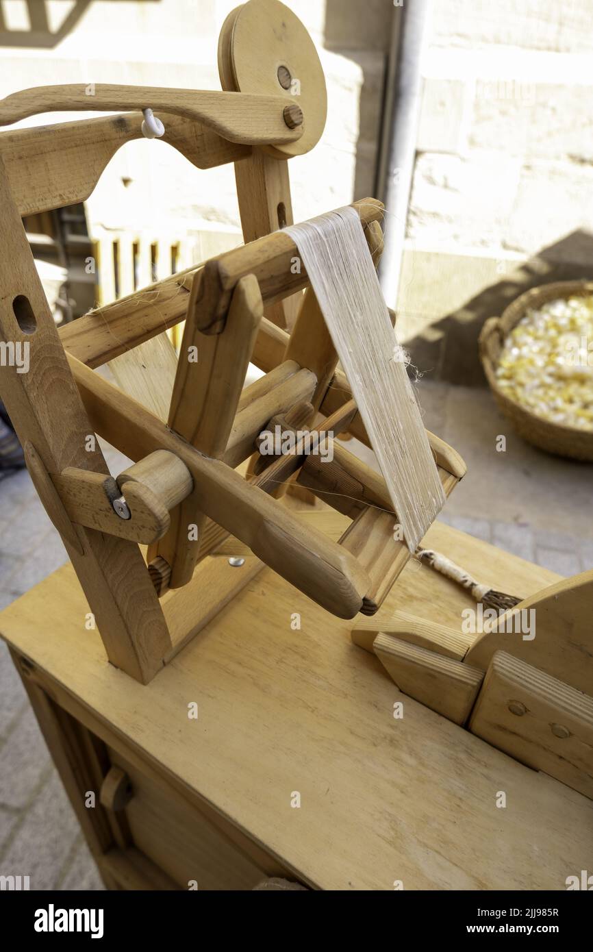 Detail of old wooden machine for spinning thread Stock Photo - Alamy