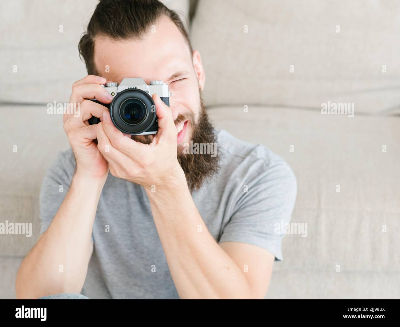 Man and camera lens hi-res stock photography and images - Alamy