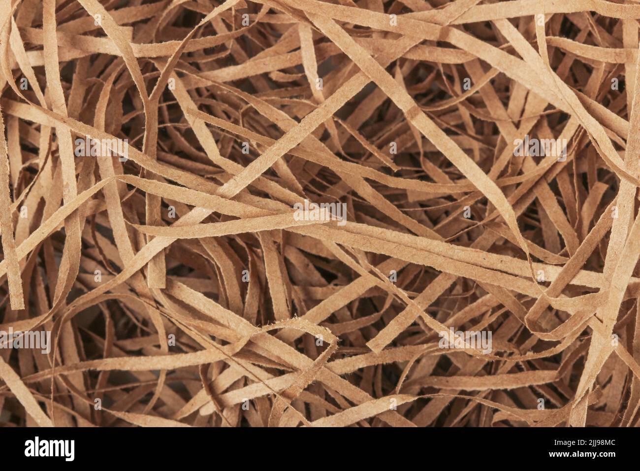 A bunch of shredded wrapping paper as a background Stock Photo - Alamy