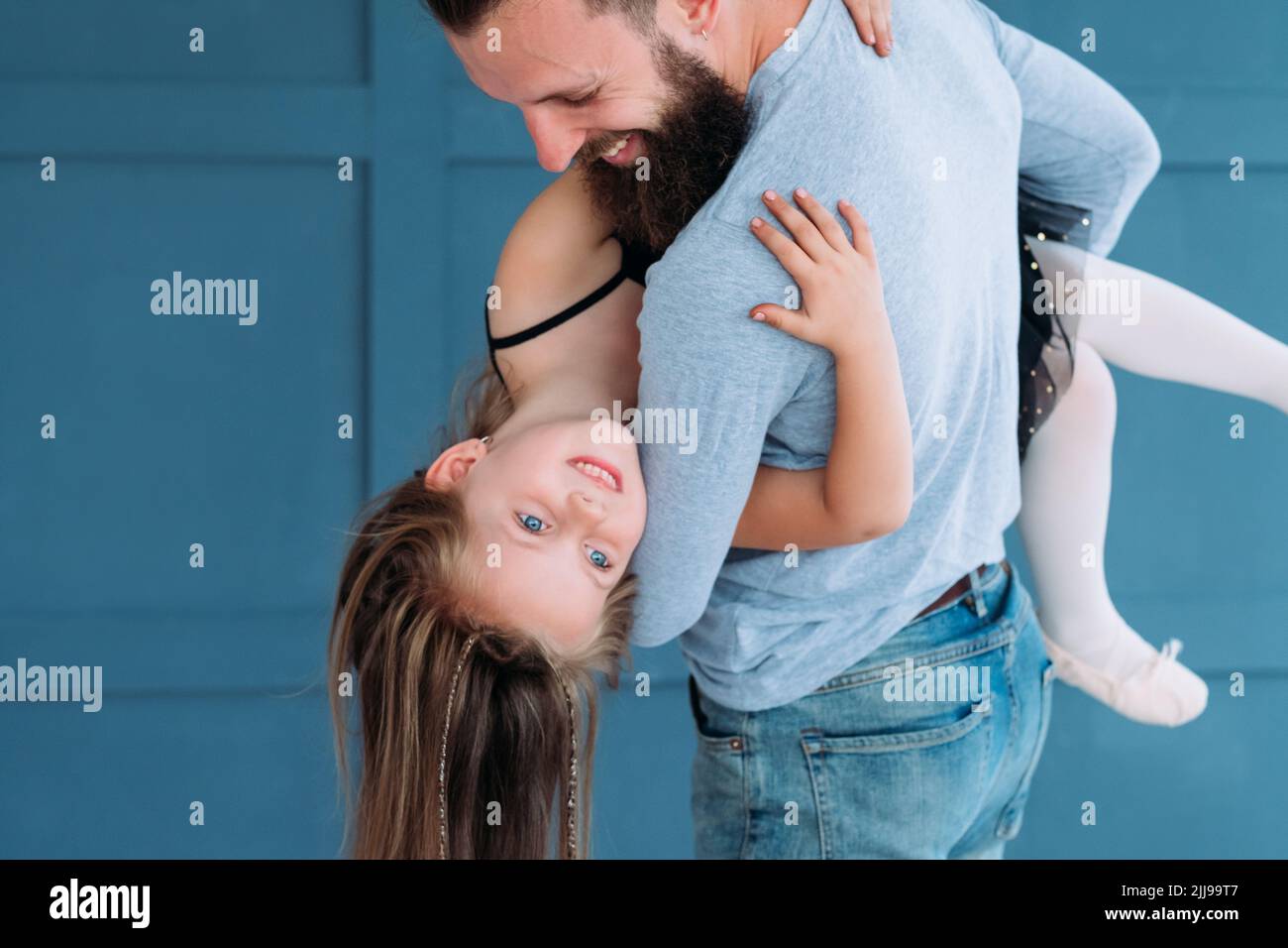 playful family leisure dad holding girl laugh joy Stock Photo - Alamy
