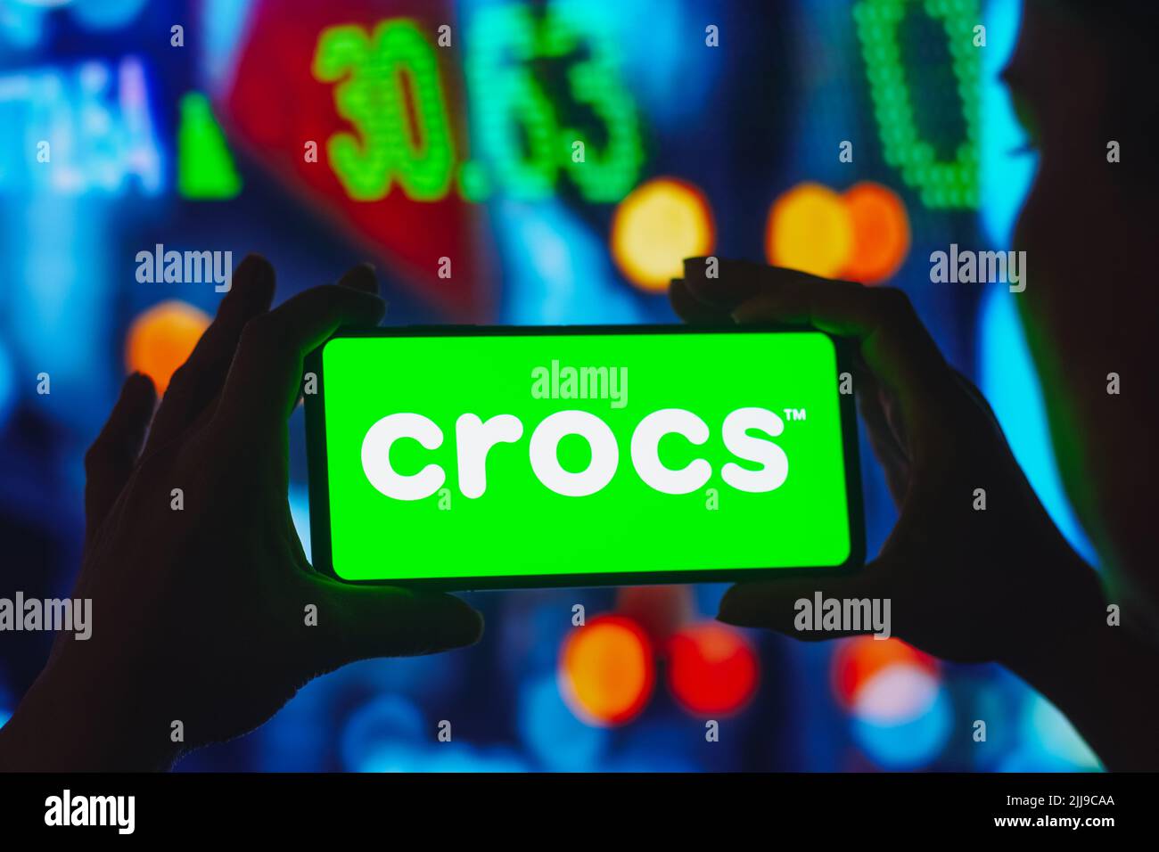 In this photo illustration, the Crocs Inc. logo is displayed on a ...