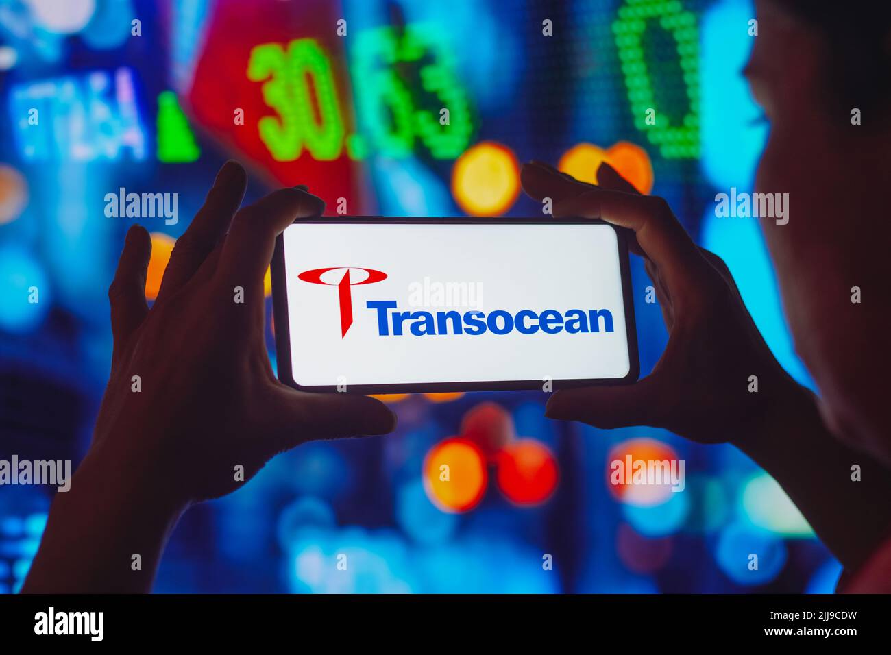 In this photo illustration, the Transocean logo is displayed on a ...