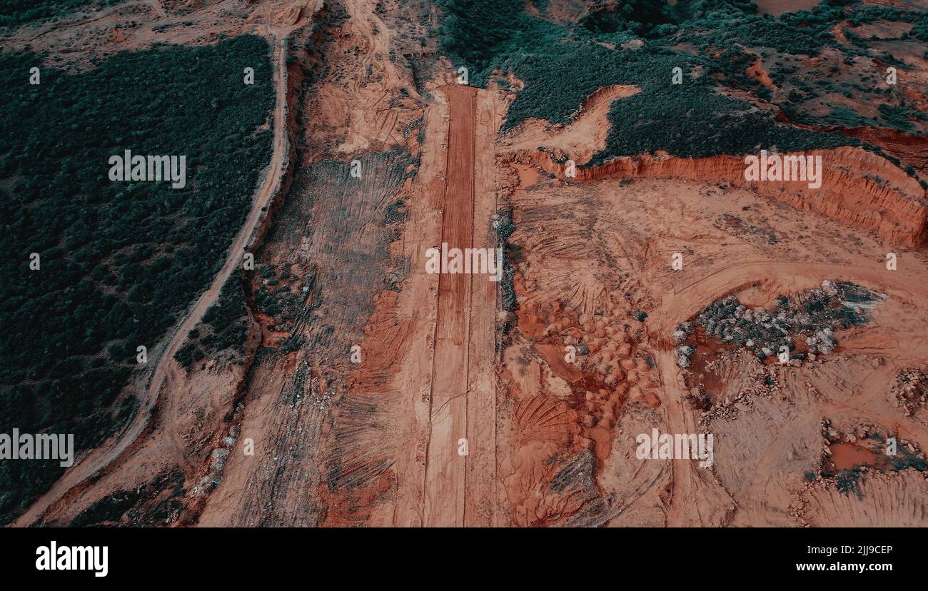 An aerial view of a muddy landscape with various geological textures ...