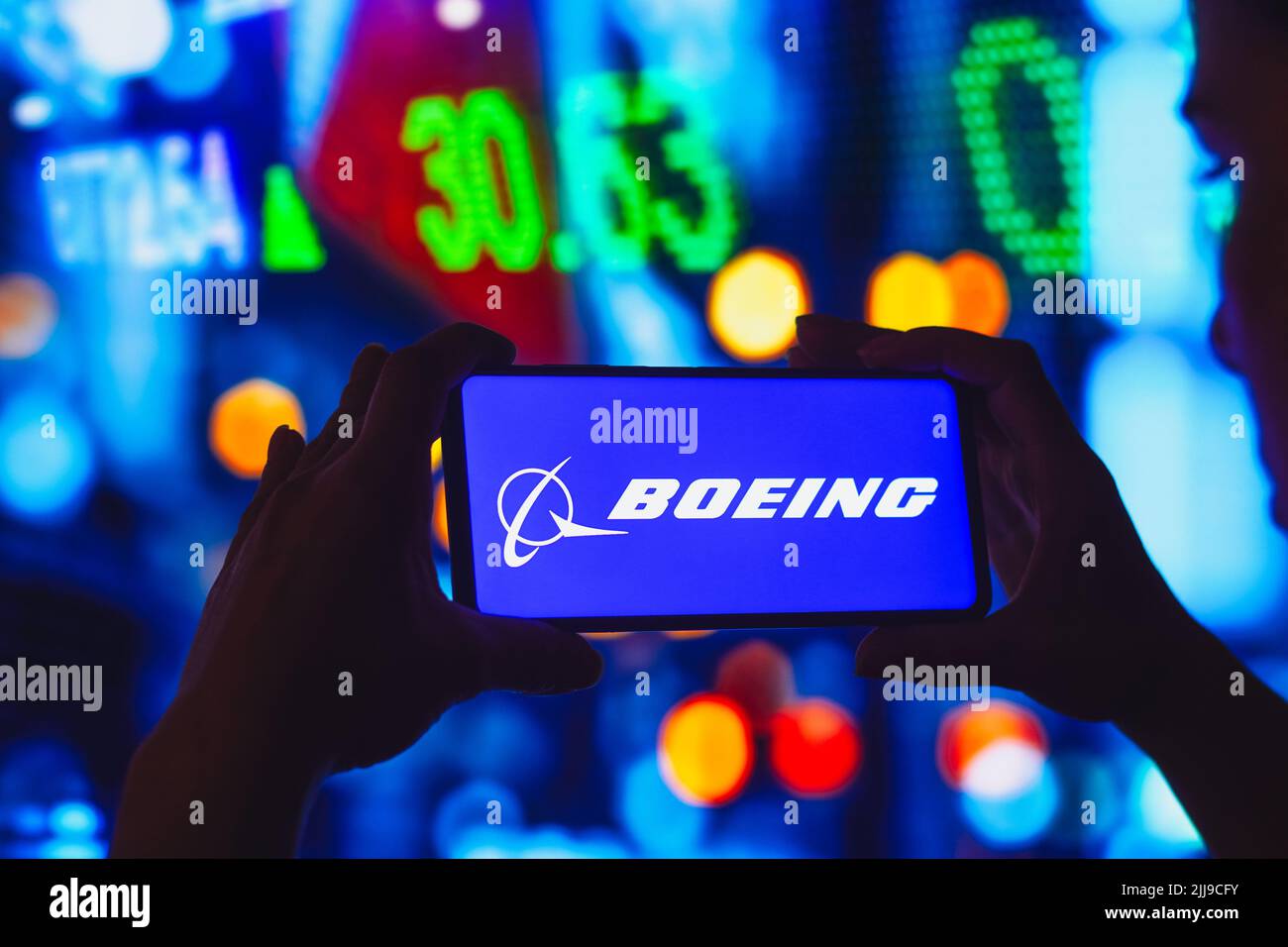 In this photo illustration, the Boeing Company logo is displayed on a ...