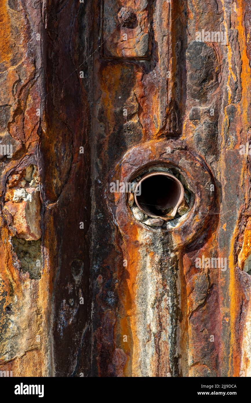 rusty old overflow outlet for water and drainage on a beach Stock Photo ...