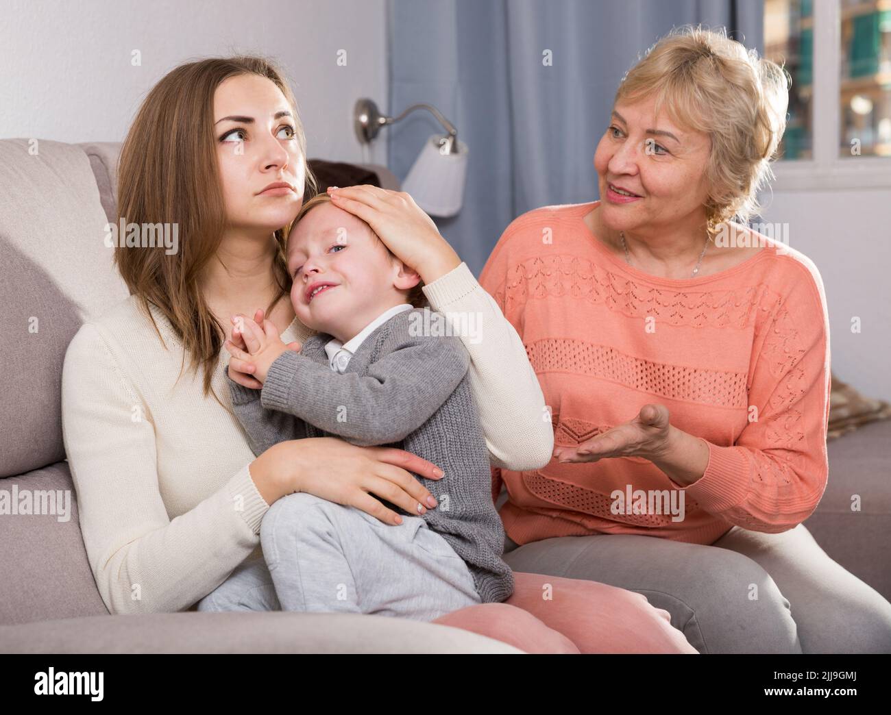Two women are quarreling for upbringing toddler Stock Photo - Alamy