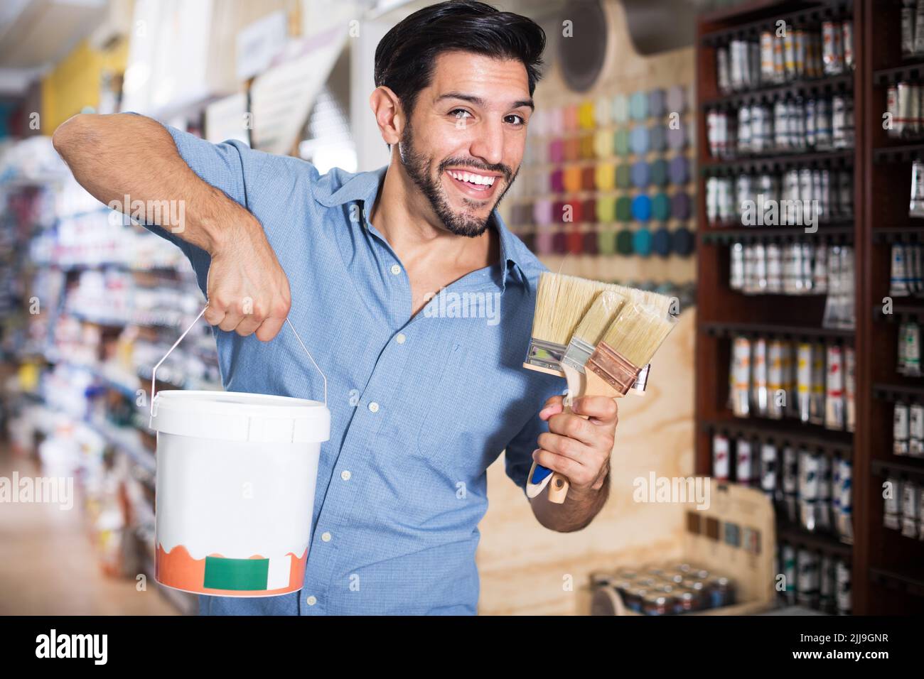 Male buyer in paint store Stock Photo - Alamy