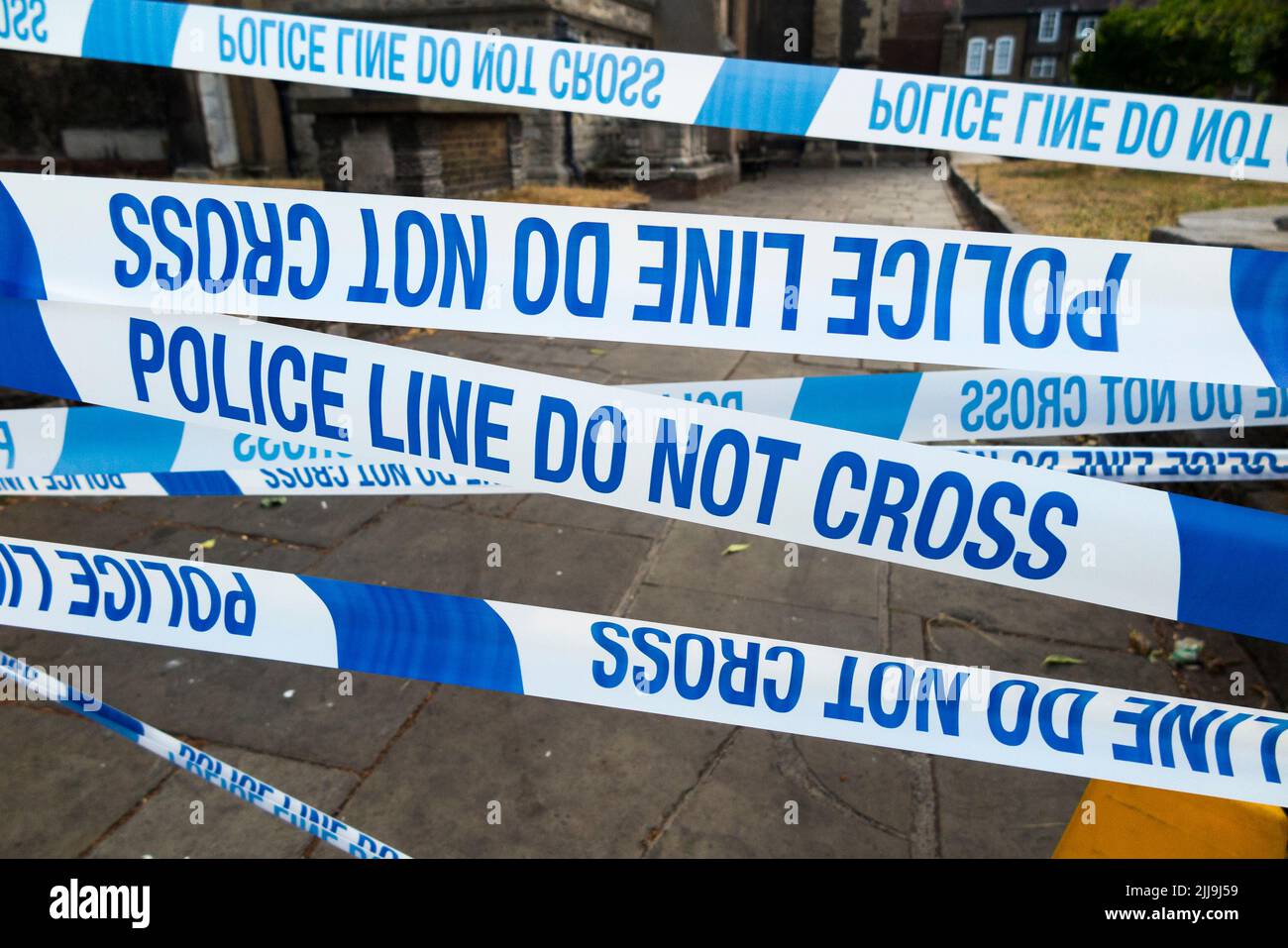 Police Line Do Not Cross tape barrier, typically placed around a crime ...