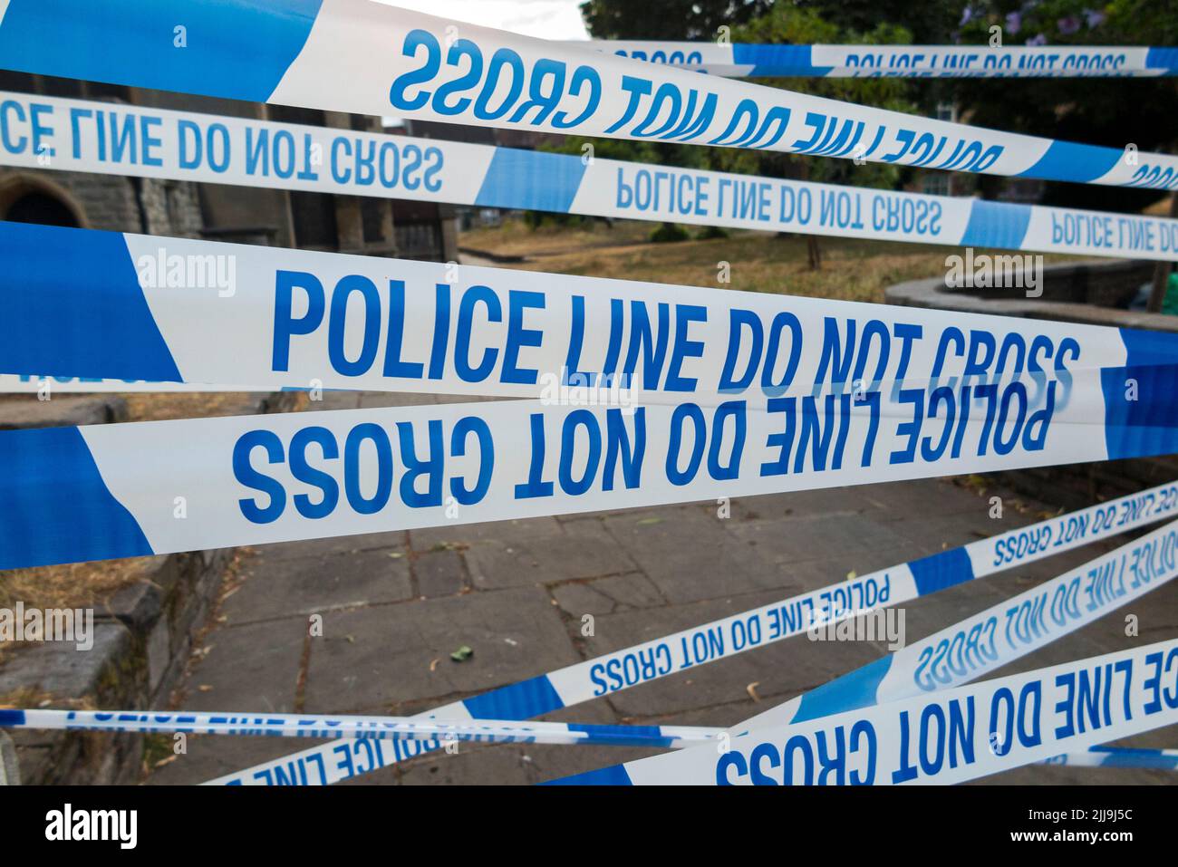 Police Line Do Not Cross tape barrier, typically placed around a crime ...