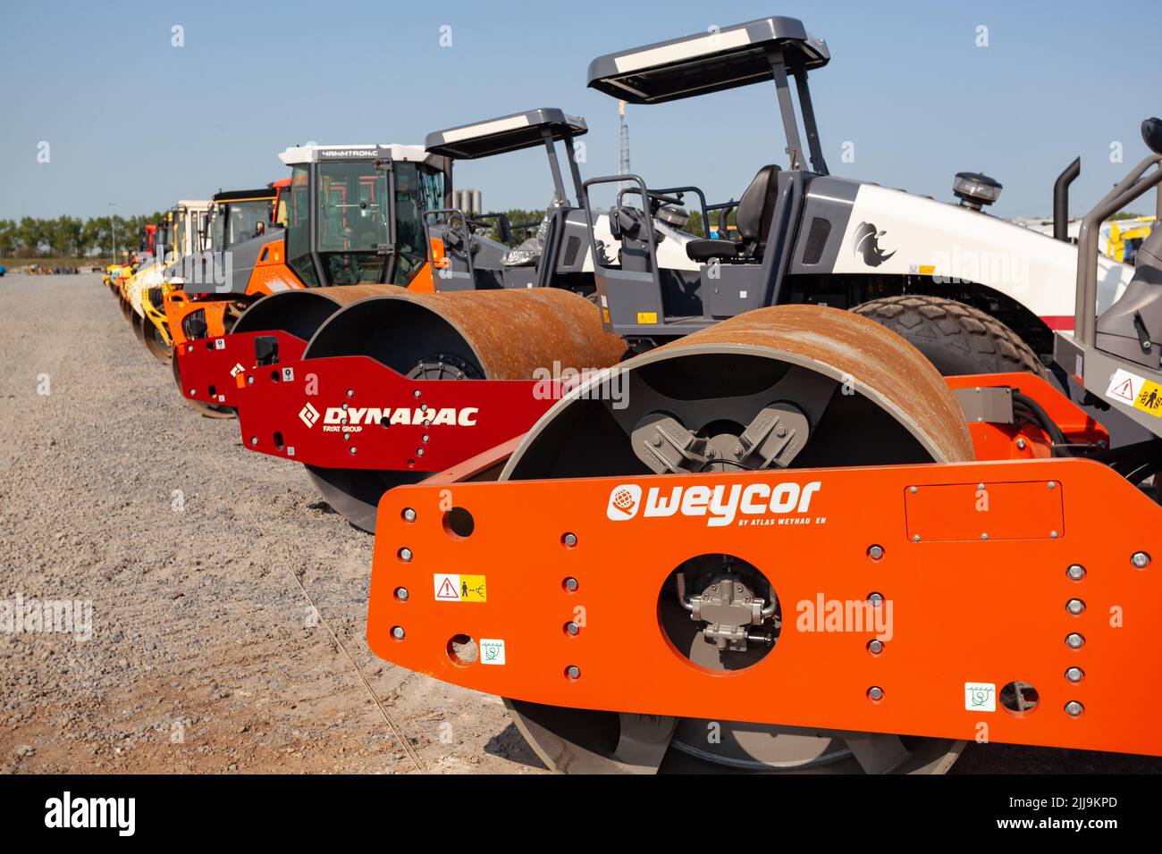 A row of steam rollers under a clear blue sky Stock Photo - Alamy