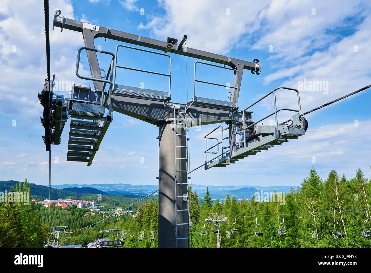 Open cable car line. Metal cable and moving rollers on platform for ...
