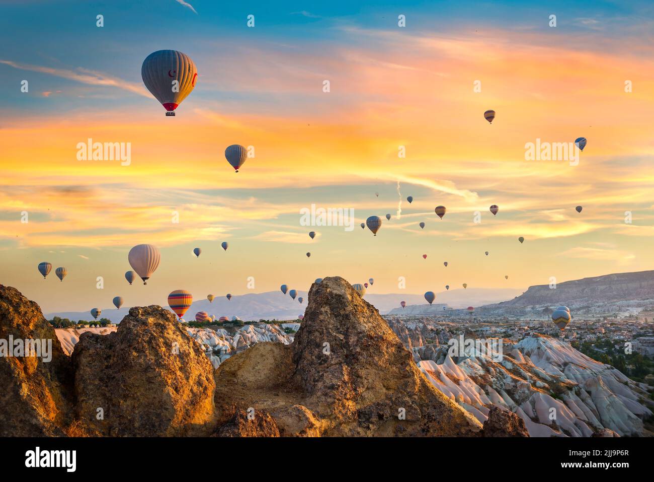 Fiery sky in Cappadocia and hot air balloons Stock Photo - Alamy