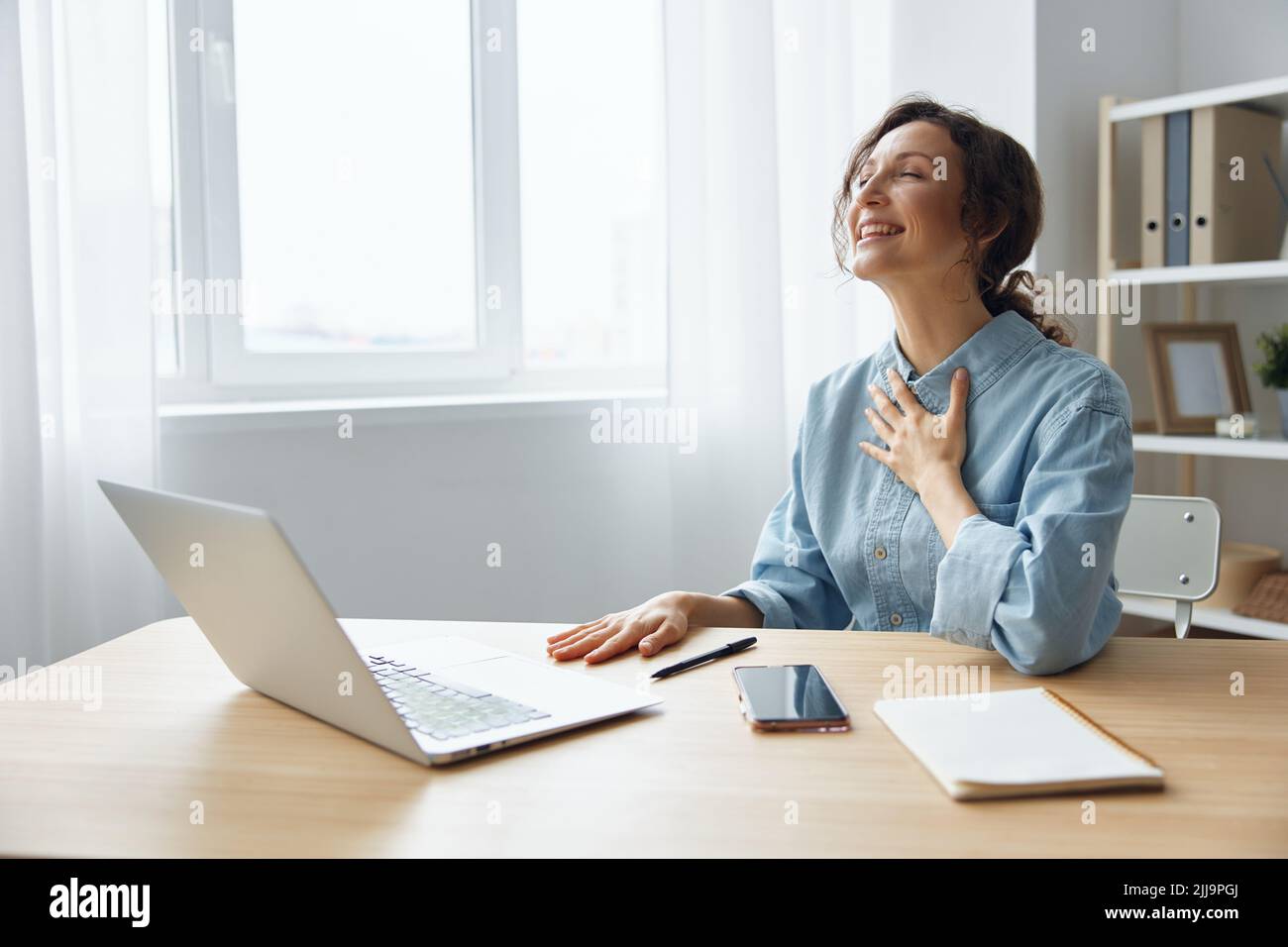 Happy enthusiastic joyful contented cute female office worker ...